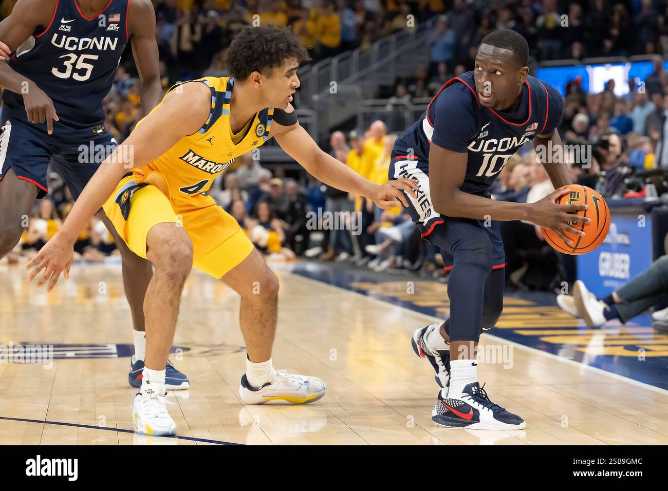 Milwaukee, WI, USA. 1st Feb, 2025. Connecticut Huskies guard Hassan Diarra (10) looks to pass ...