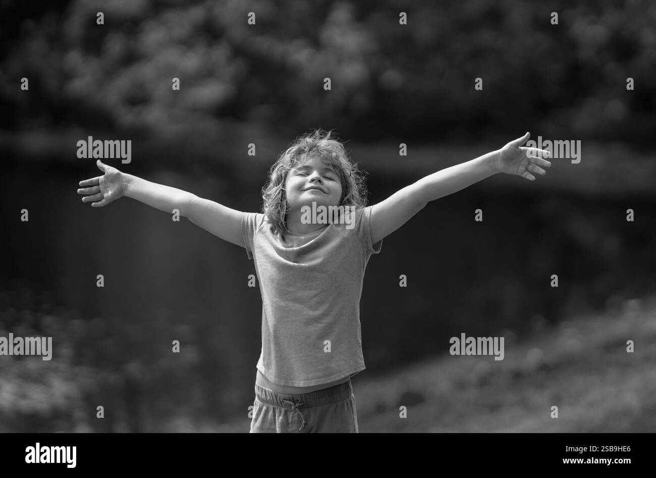 Happy child with arms up enjoying freedom in nature. Child ppen arms ...