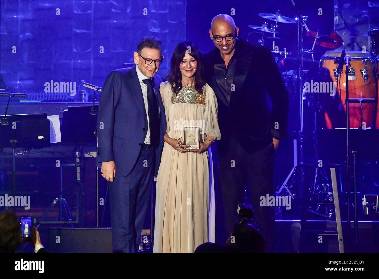 Lucian Grainge, from left, Jody Gerson, and Harvey Mason Jr. pose ...