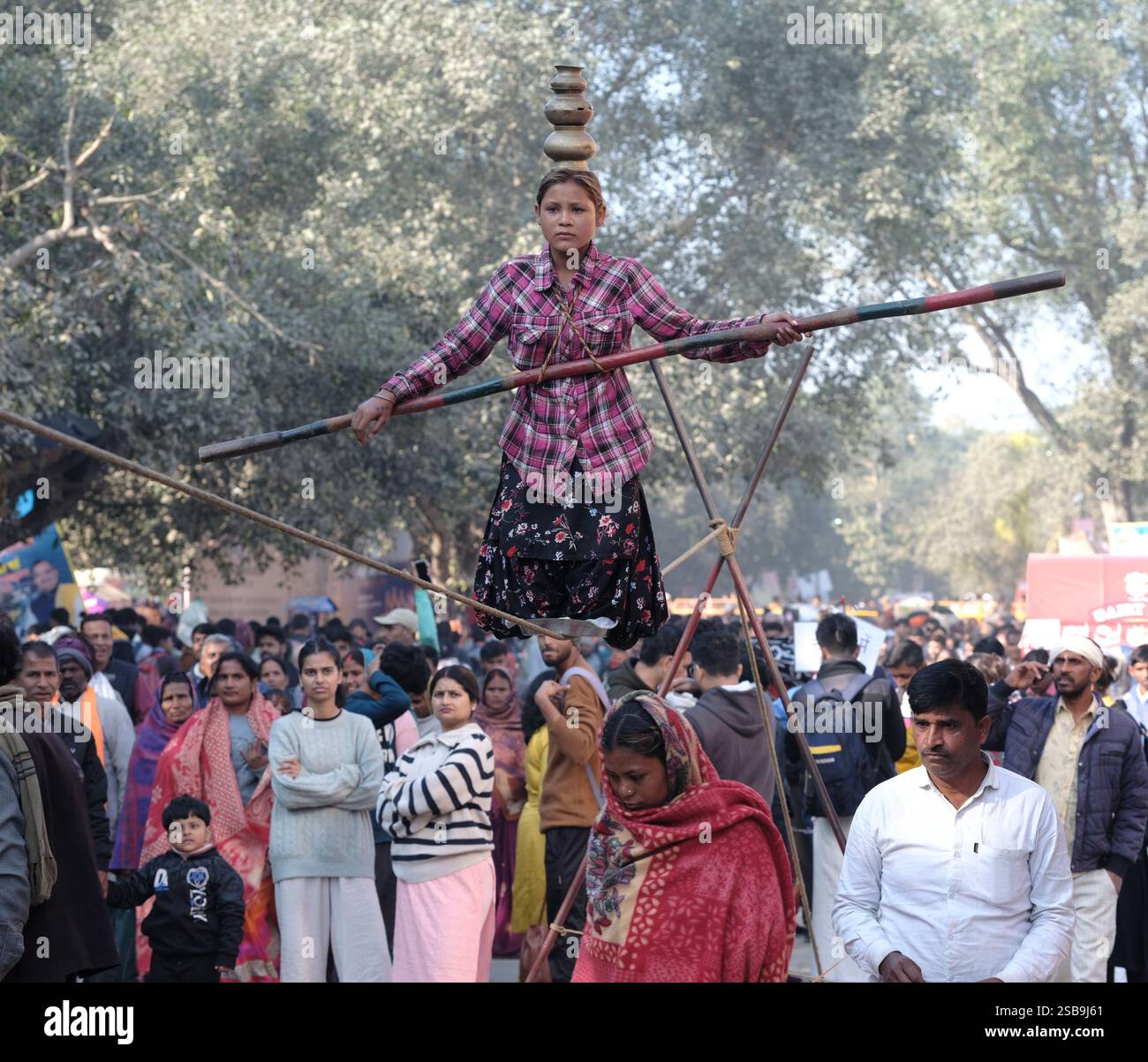 Defying gravity and expectations, the young performer walks the rope at the Maha Kumbh Mela in ...