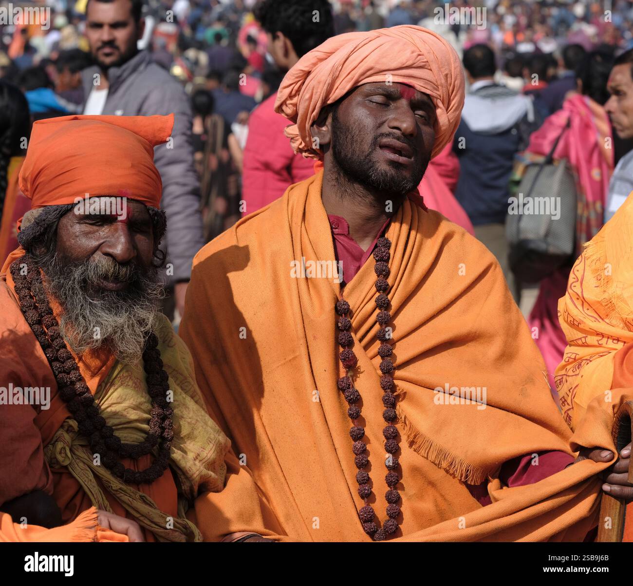 A vibrant gathering of blind Krishna sadhus gracefully collecting alms ...