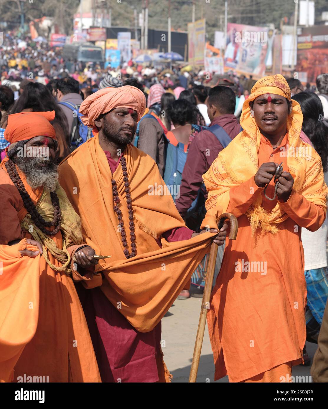 A vibrant gathering of blind Krishna sadhus gracefully collecting alms ...