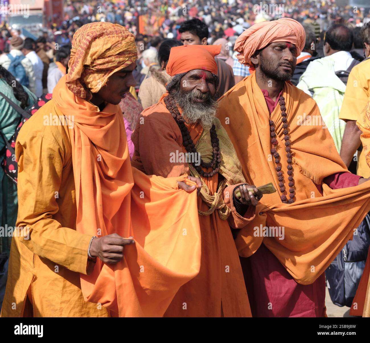 A vibrant gathering of blind Krishna sadhus gracefully collecting alms ...