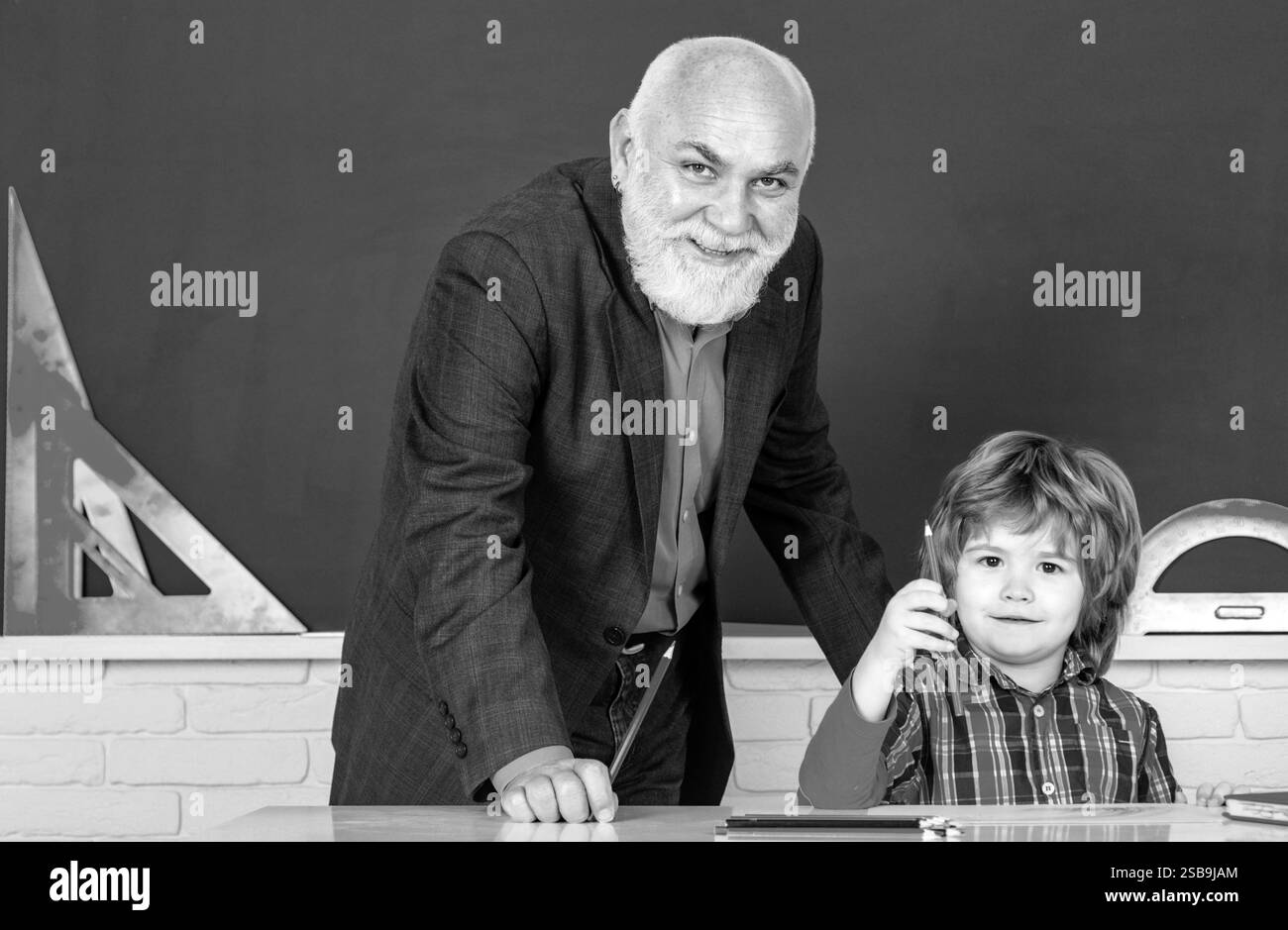 Portrait of grandfather and Son in classroom. Father and son ...