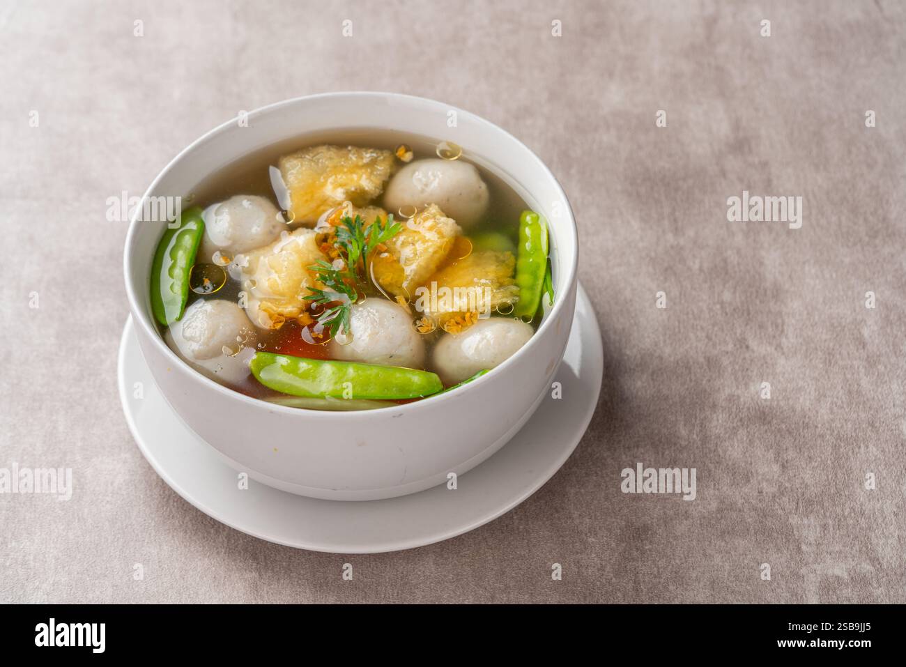 Fish Ball Soup with Fish belly crackers are called hipio Stock Photo ...