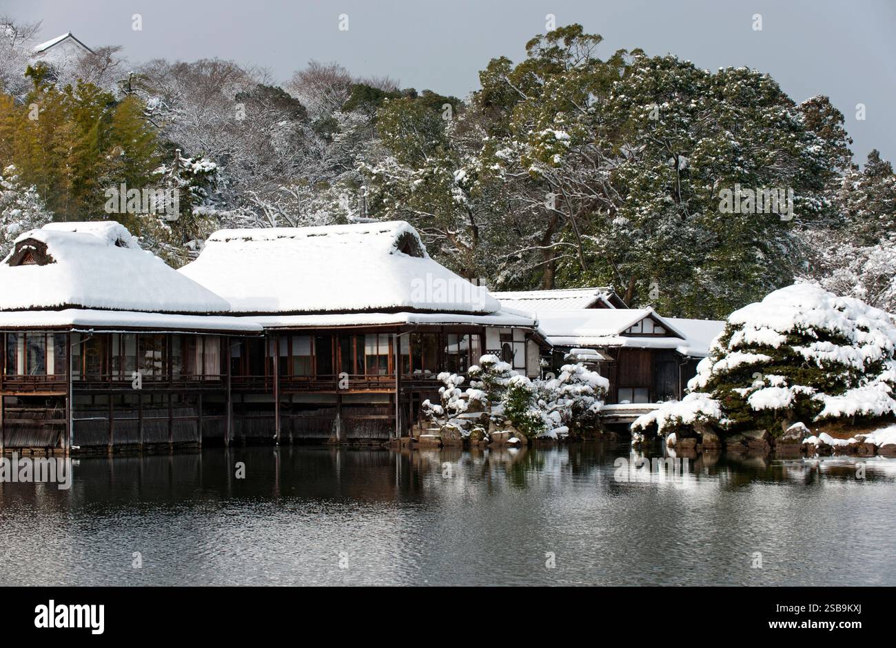 Snowy winter scene at Hikone Castle Genkyuen landscape garden in Hikone ...