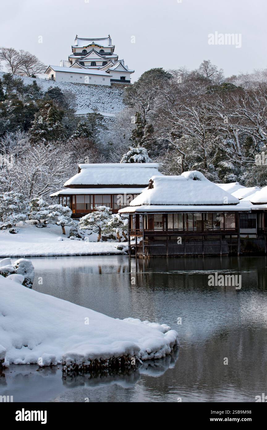 Snowy winter scene at Hikone Castle Genkyuen landscape garden in Hikone ...