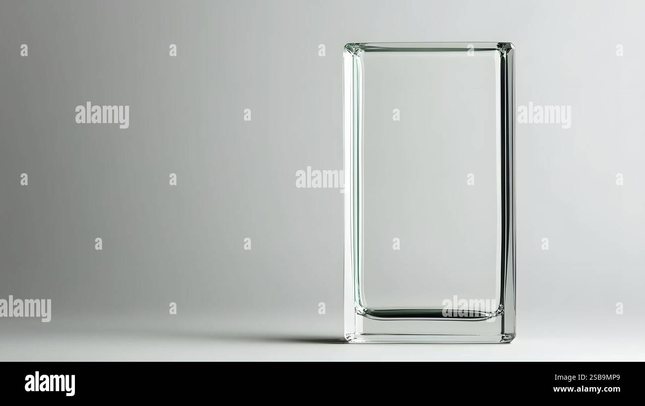 Clear rectangular glass trophy with beveled edges,displayed on a plain ...