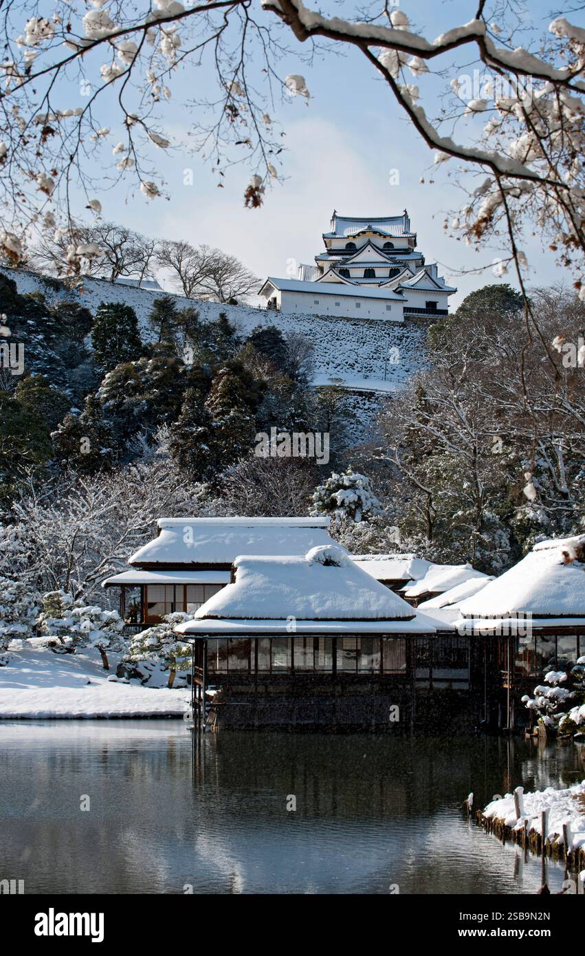 Snowy winter scene at Hikone Castle Genkyuen landscape garden in Hikone ...