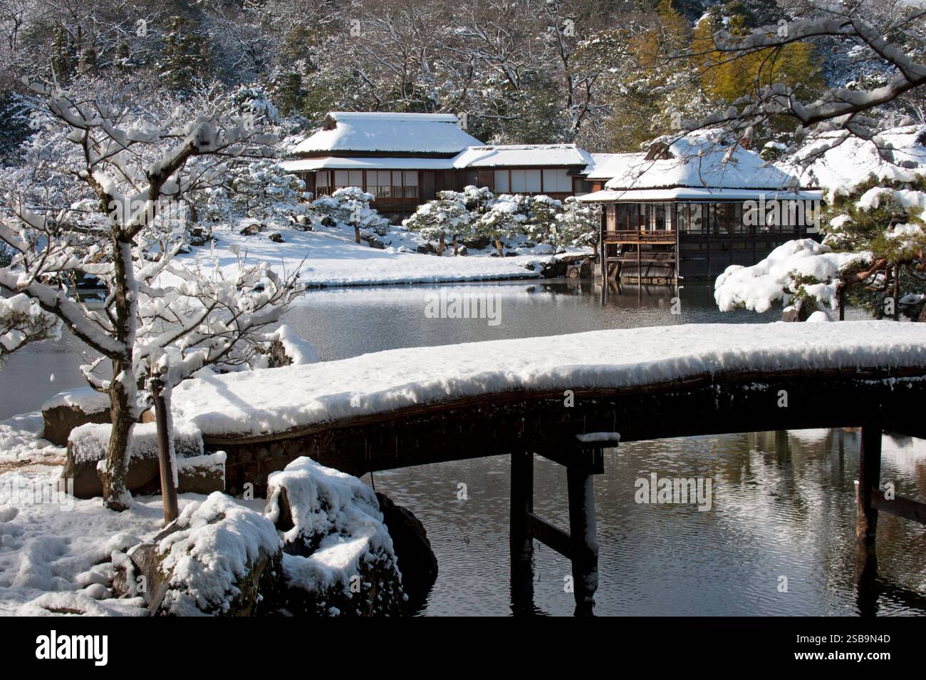 Snowy winter scene at Hikone Castle Genkyuen landscape garden in Hikone ...