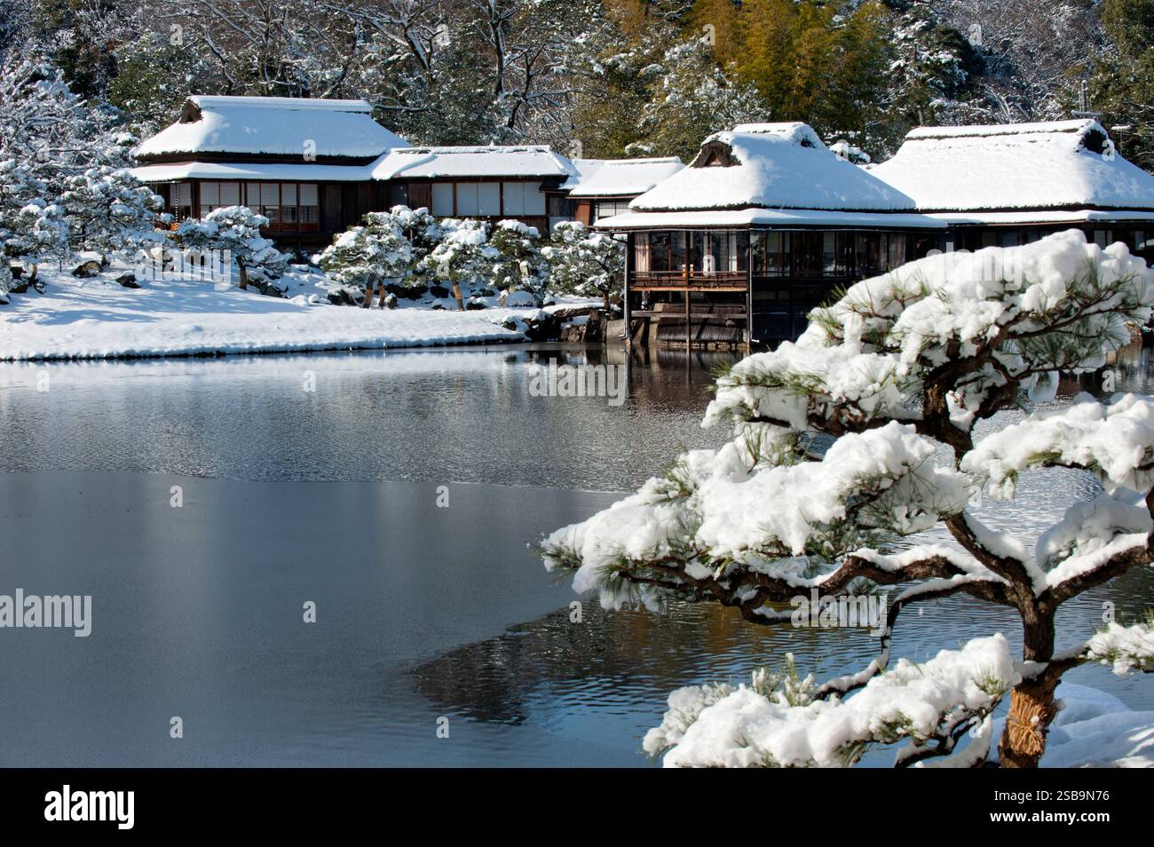 Snowy winter scene at Hikone Castle Genkyuen landscape garden in Hikone ...