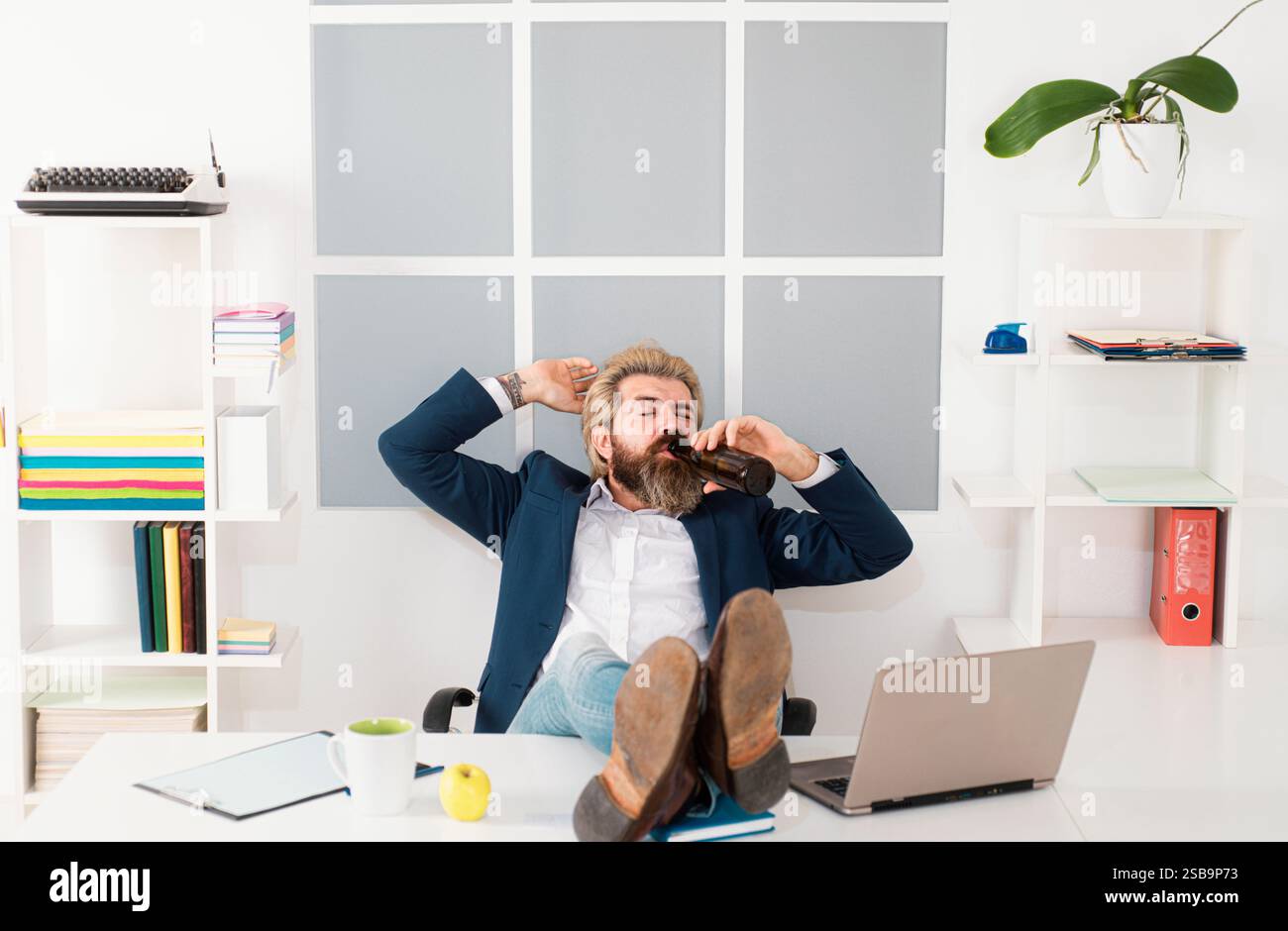 Drunk man at the end of the working day. Businessman drink beer in his ...