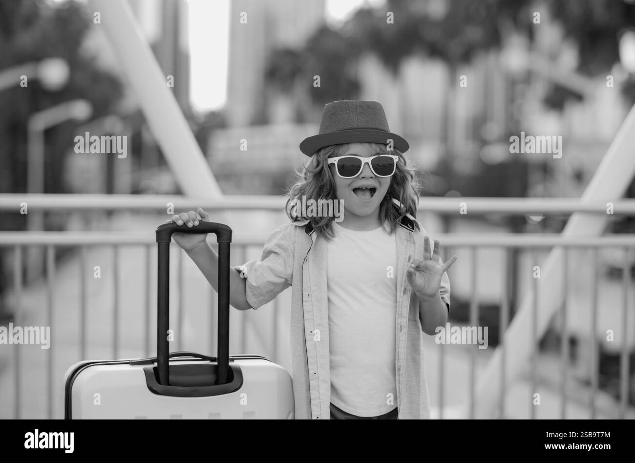 Tourist child with luggage travel bag travelling. Kid with suitcase ...
