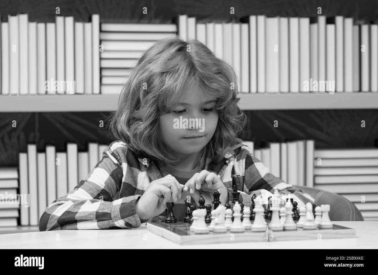 Chess school. Kid playing chess. Child thinking near chessboard ...