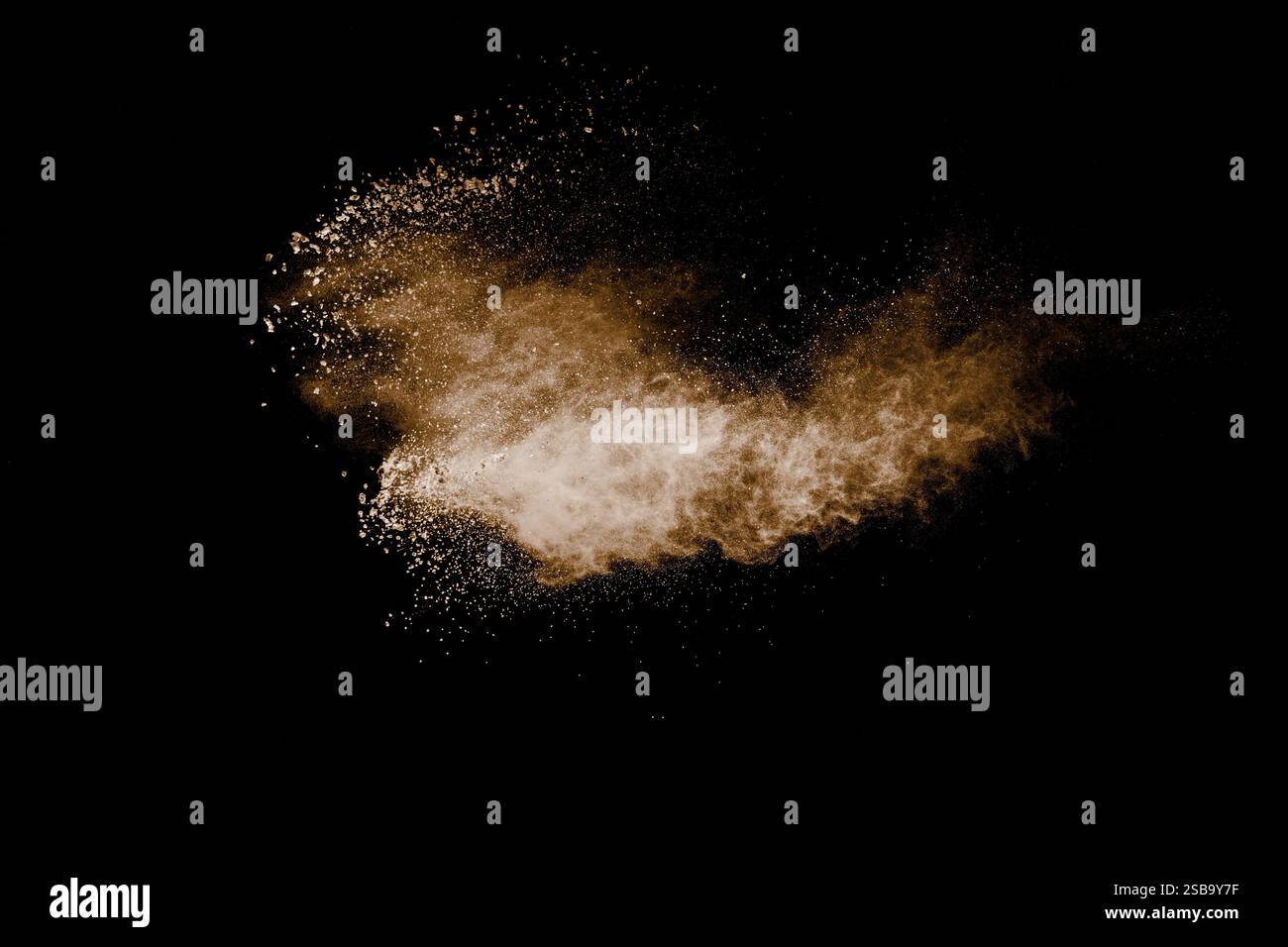 Cloud of brown dust is blowing in the wind. The dust is brown and is ...