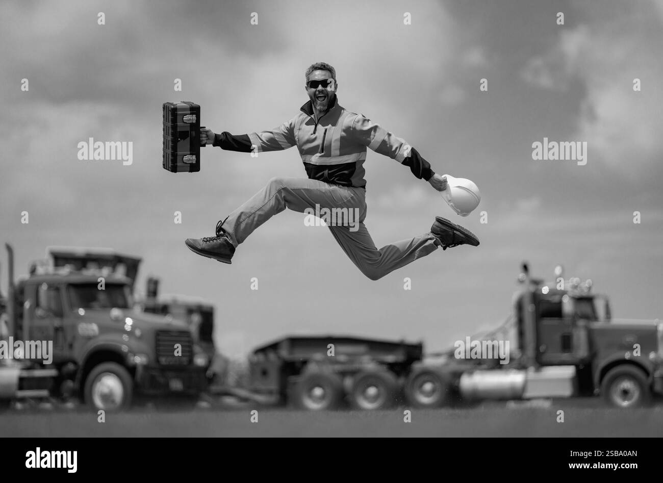 Construction builder excited jump in building uniform on buildings ...