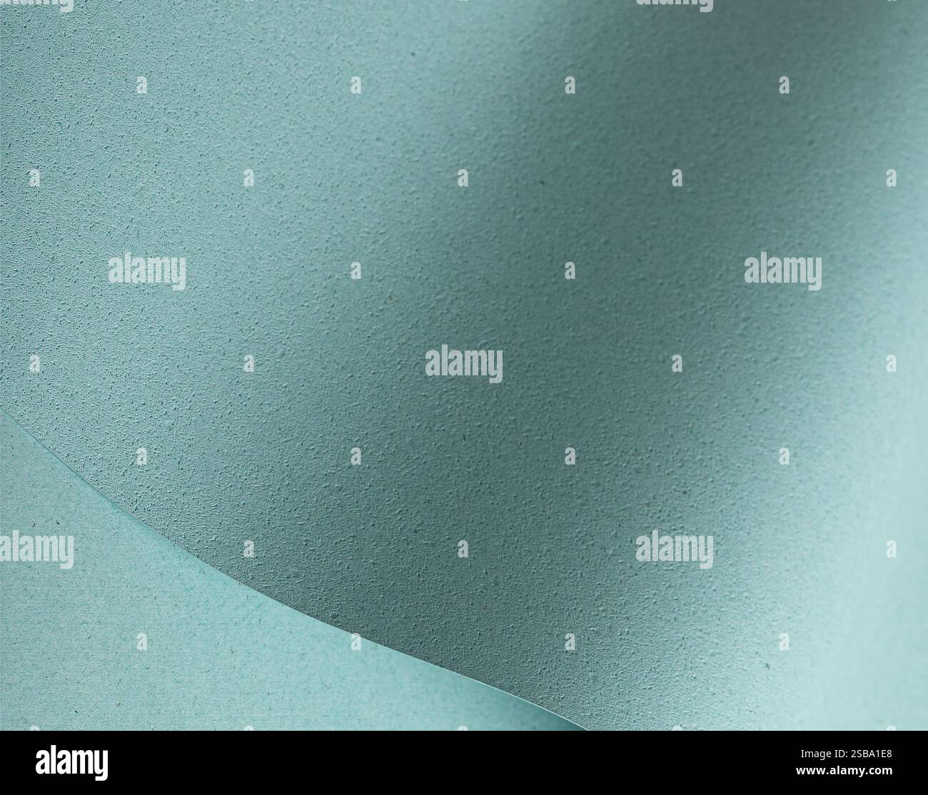 A pastel blue textured paper background featuring punched and ...