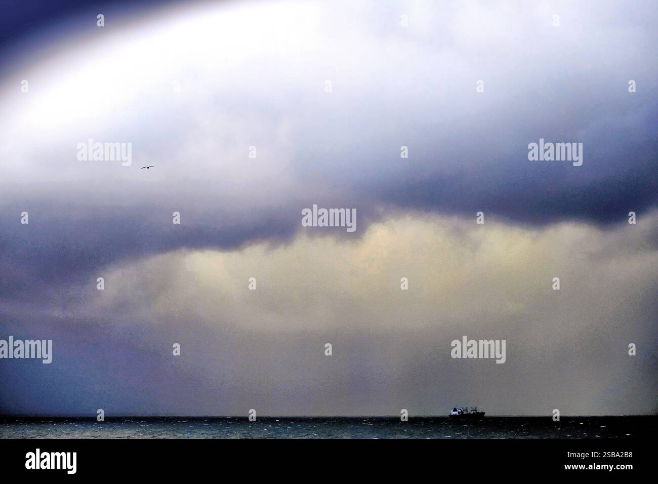 Cargo ship battling alone in storm clouds North sea Stock Photo - Alamy