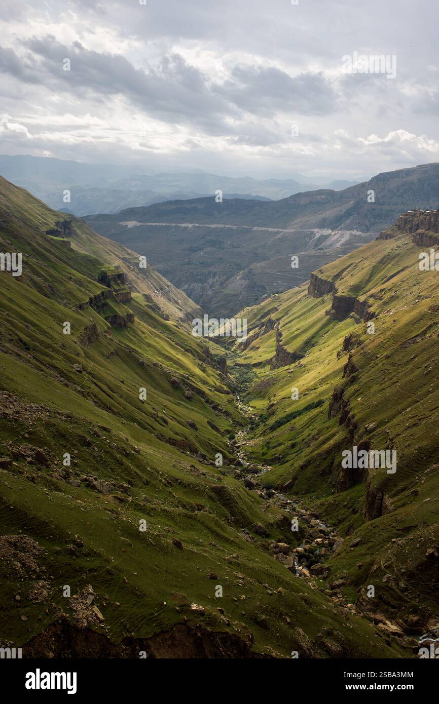 An epic view of a huge mountain rift, the terrain is covered with ...
