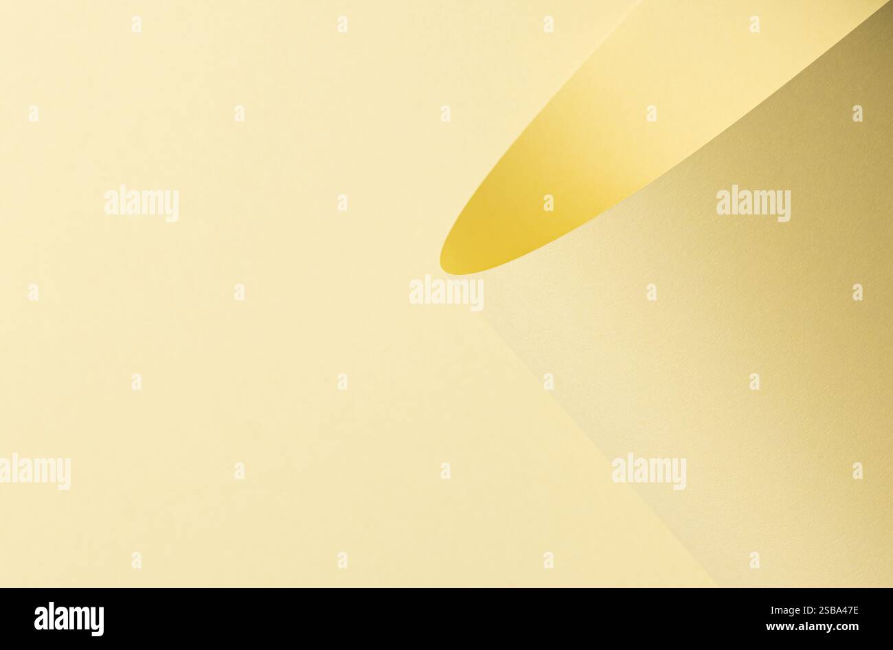Pale yellow paper background with a smooth matte surface and soft ...