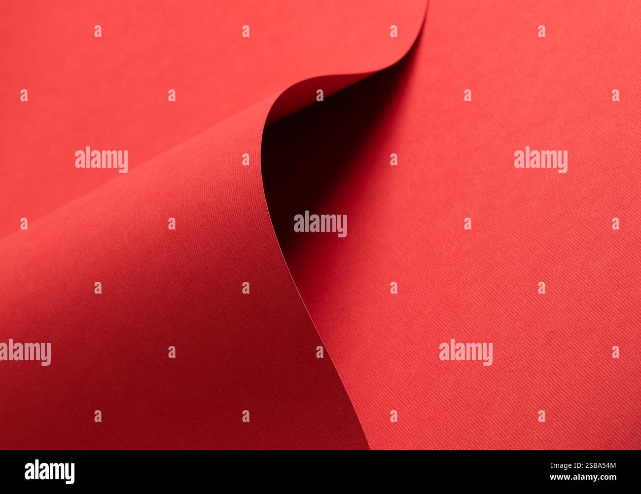 Red paper background with a matte texture and soft tones. Bold crimson ...