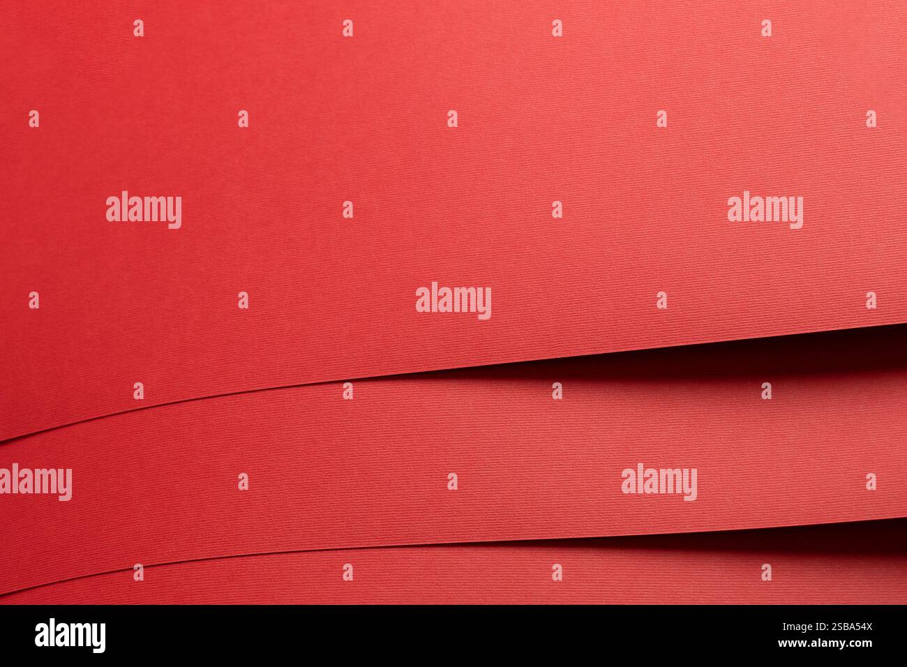 Red paper background with a matte texture and soft tones. Bold crimson ...