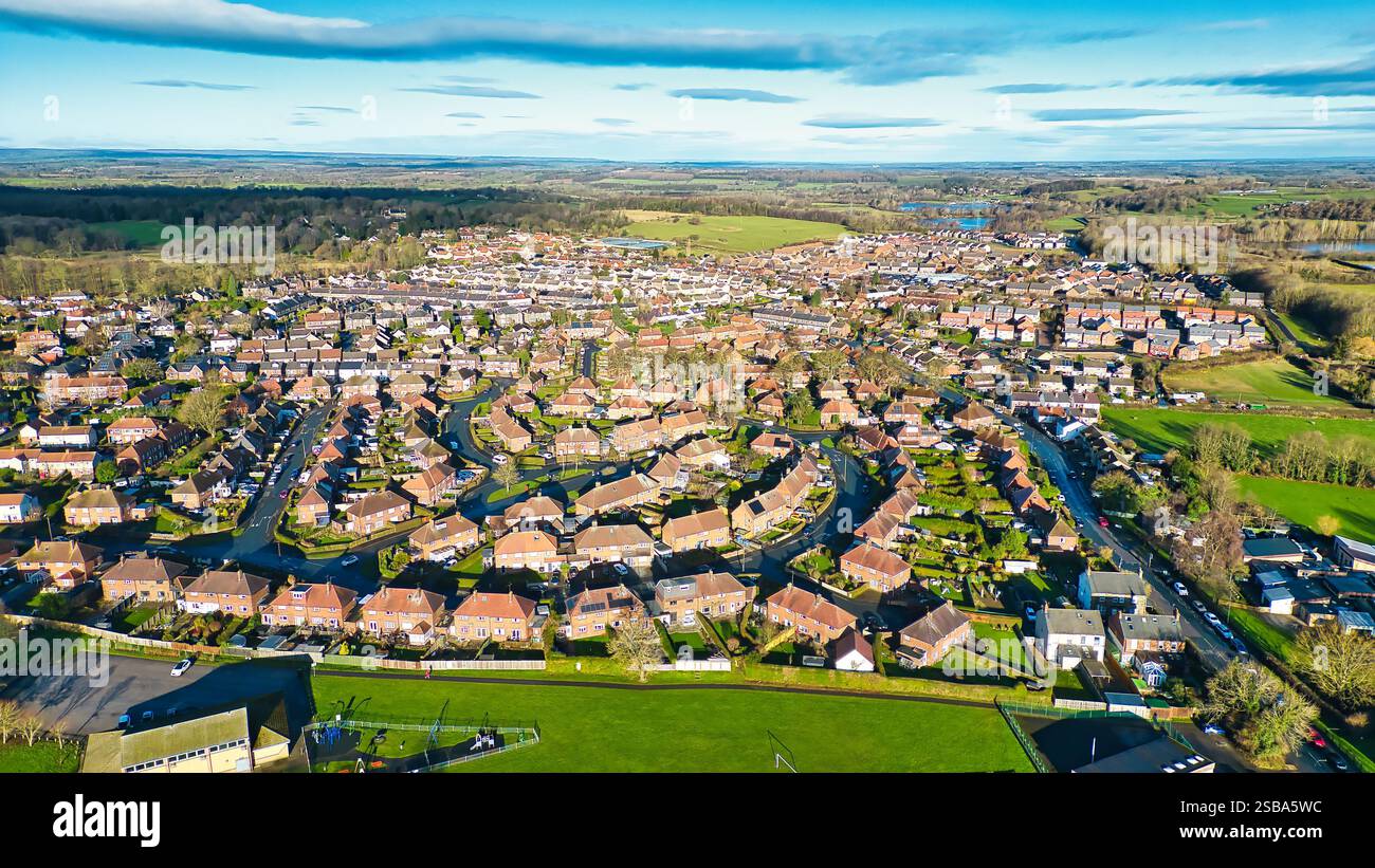 Aerial view of a large residential area featuring numerous brick houses ...