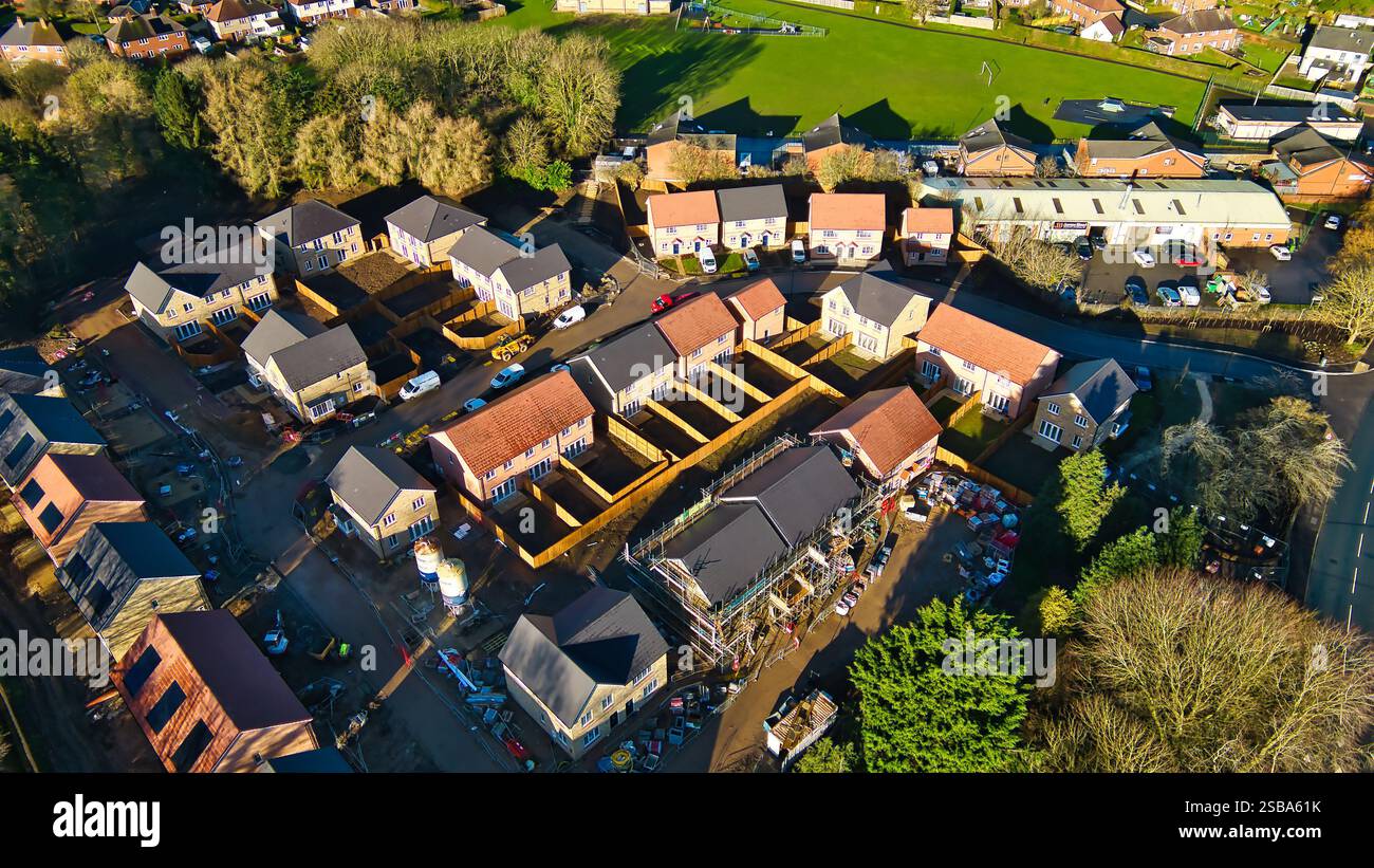 Aerial view of a new housing development, showcasing rows of two-story ...