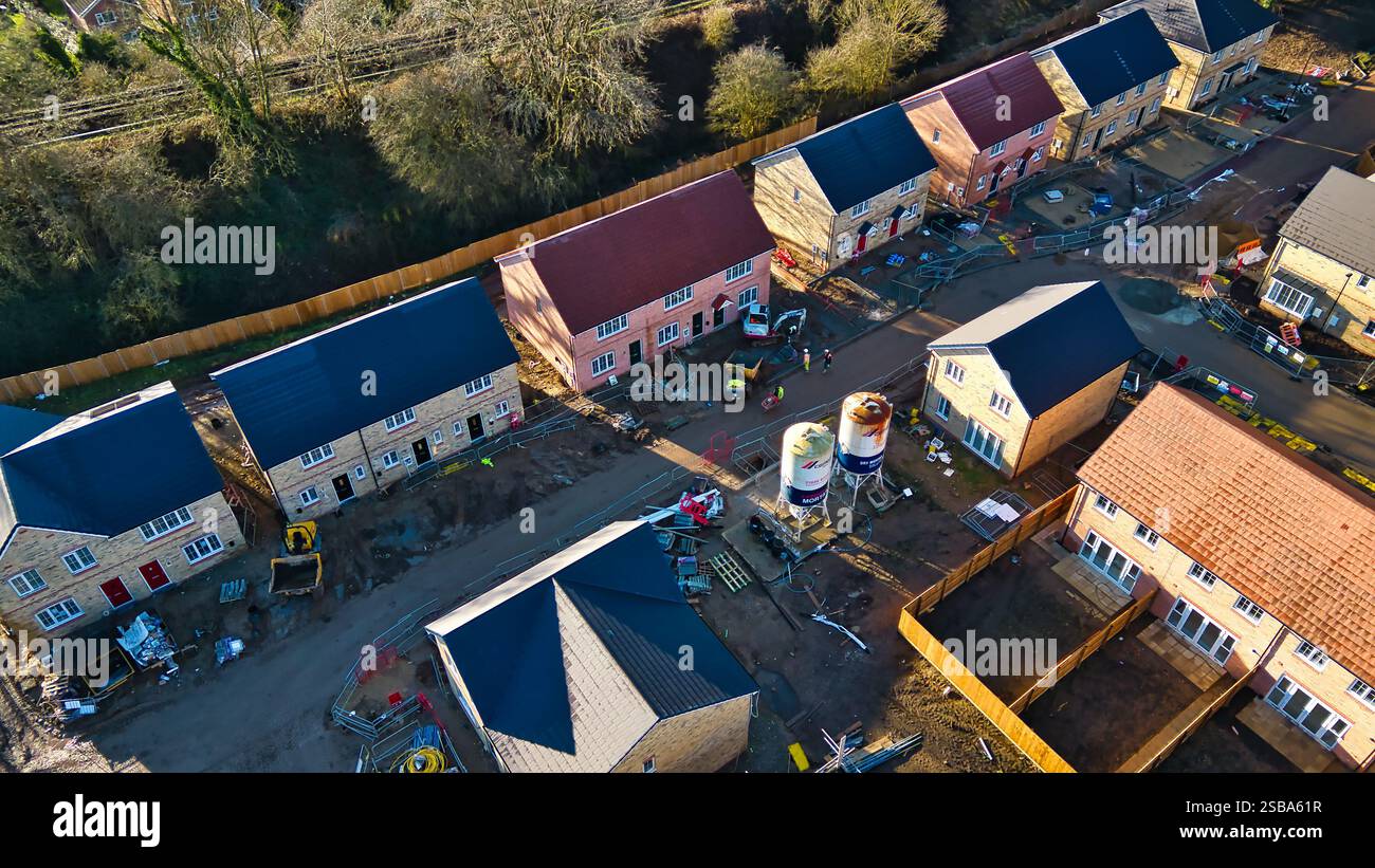 Aerial view of a new housing development under construction. Rows of ...
