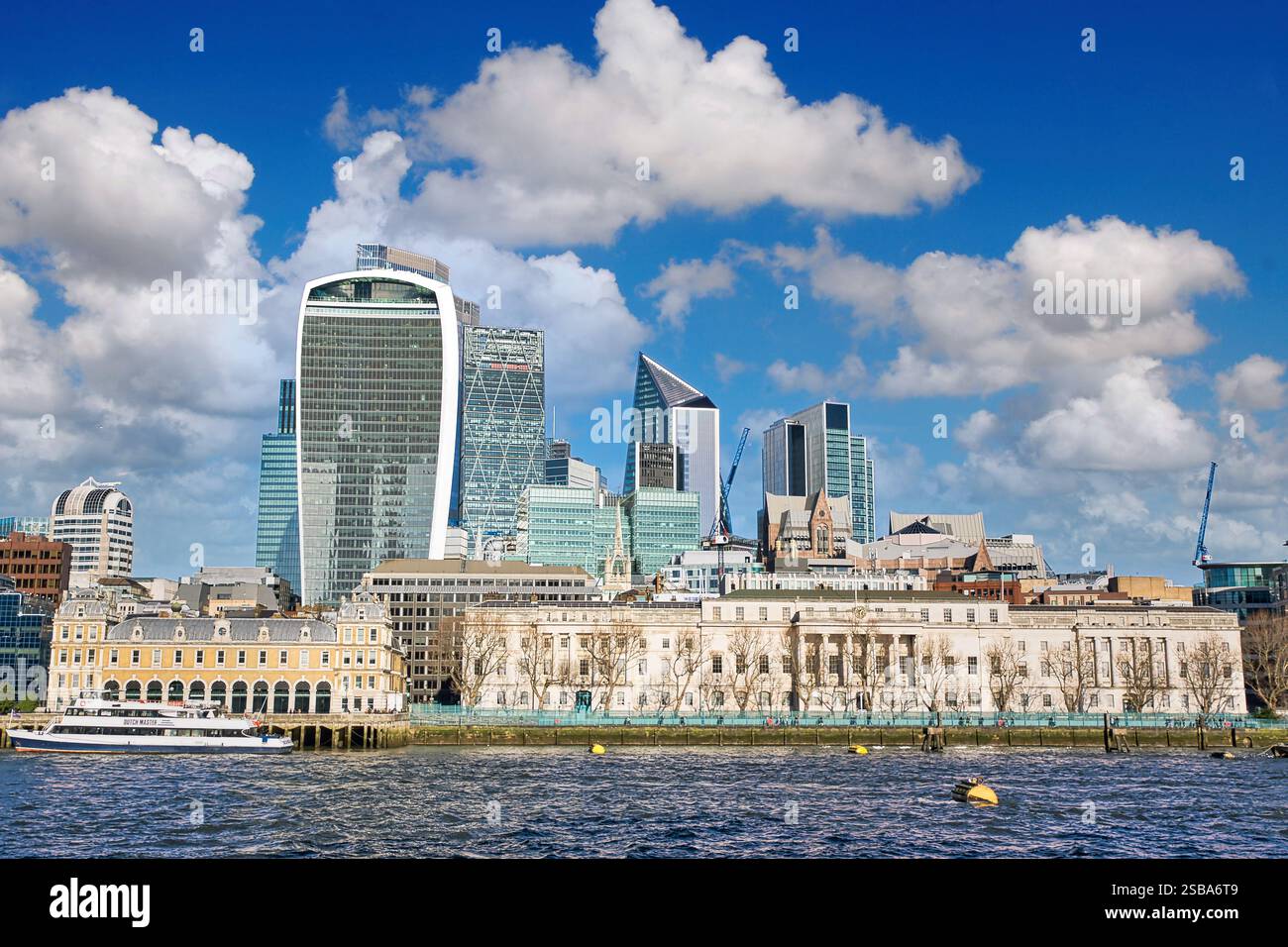 London skyline viewed from across the Thames River, featuring modern ...