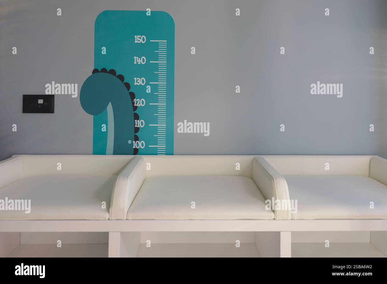 Doctor's baby changing table, close-up view. A meter for measuring the ...