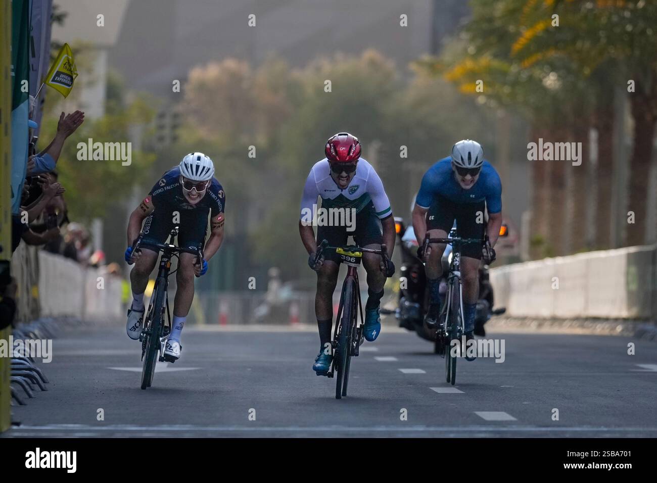 Ibrahiem Alrefai of Syria, centre, sprints to the finish line to win ...