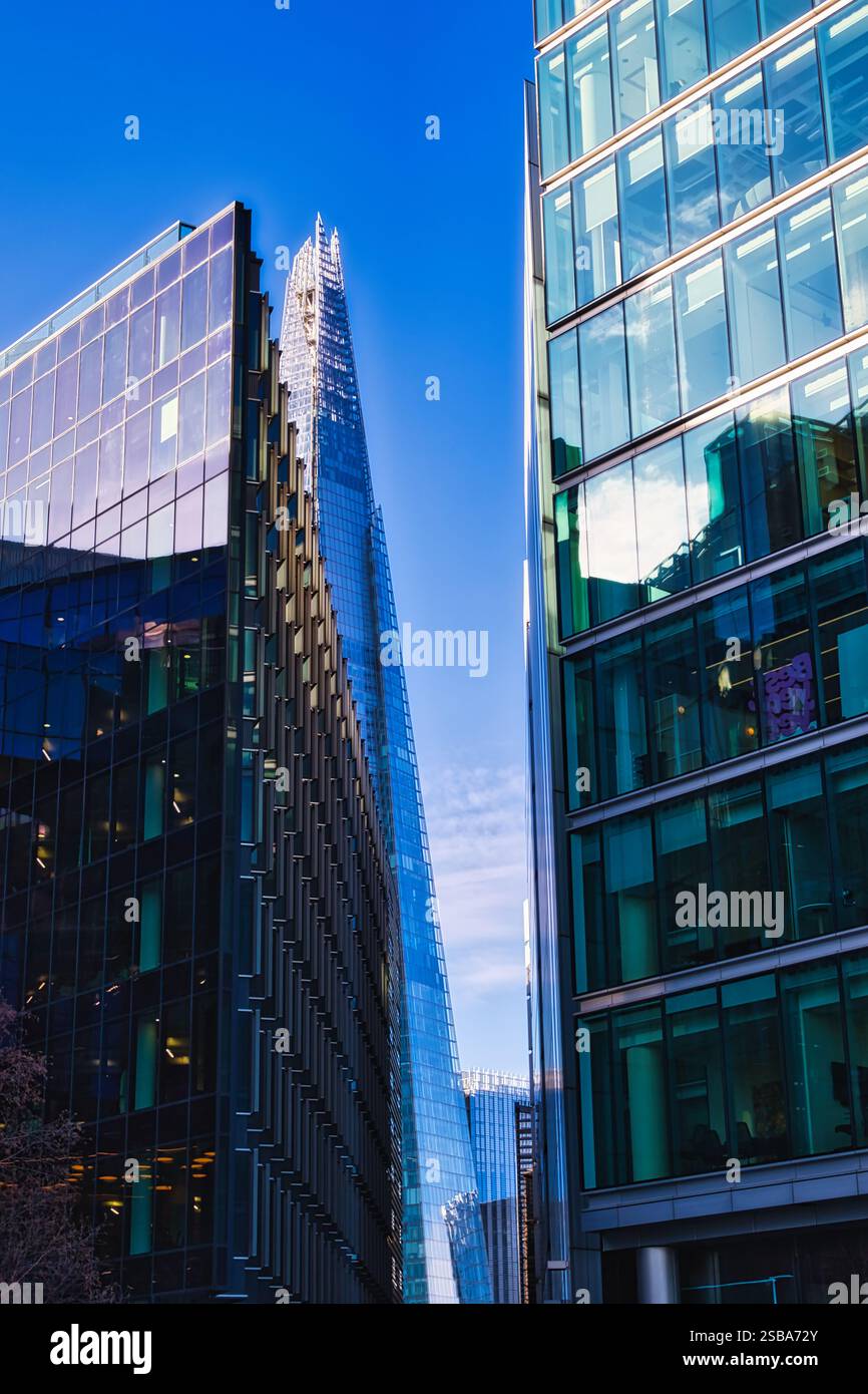 Three modern glass skyscrapers in London, England, are shown against a ...