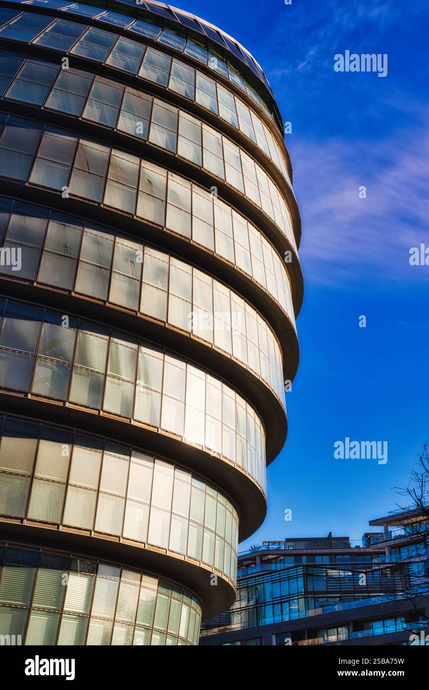 Curved glass facade of a modern building, possibly an office complex ...