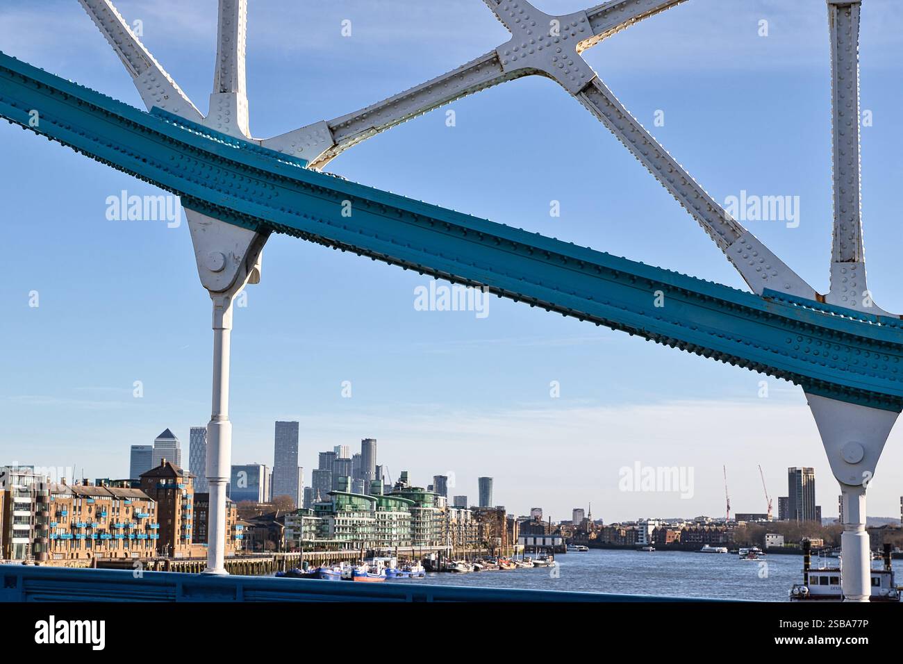 Close-up view of a teal and white bridge structure against a backdrop ...