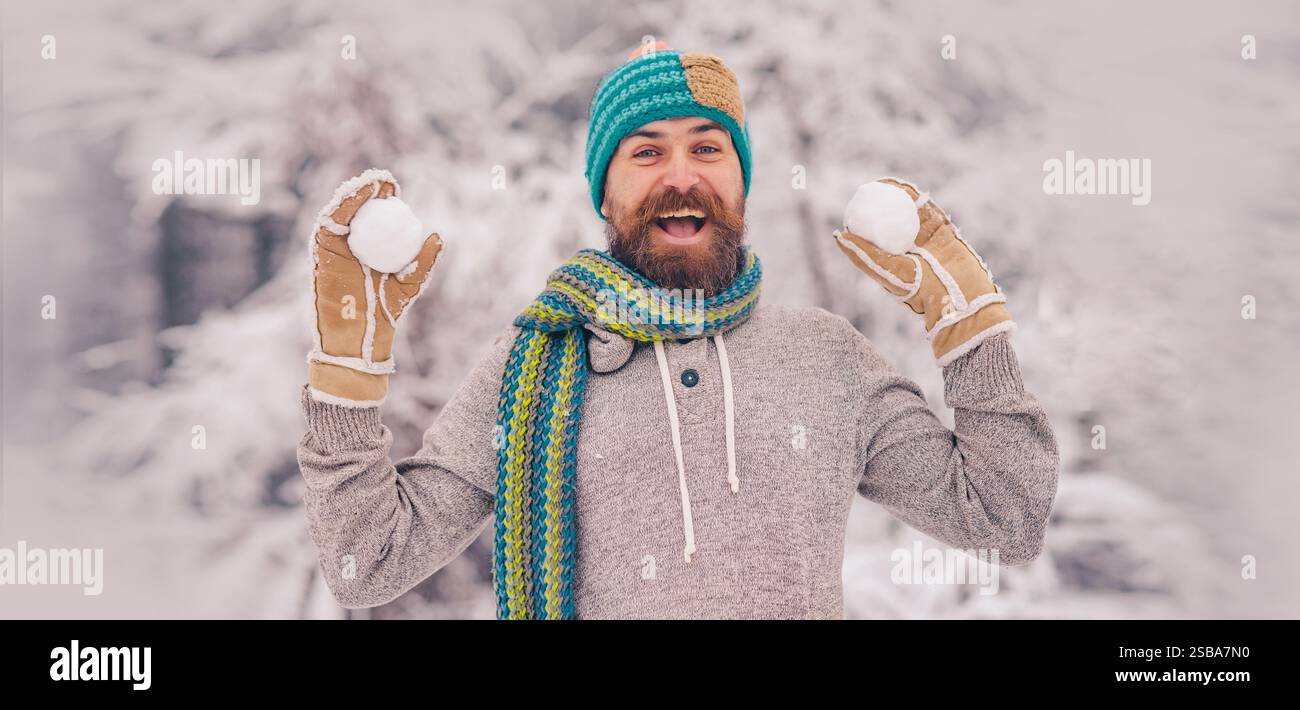 Guy throws snowballs. Snow games. Man play with snow and snowball ...