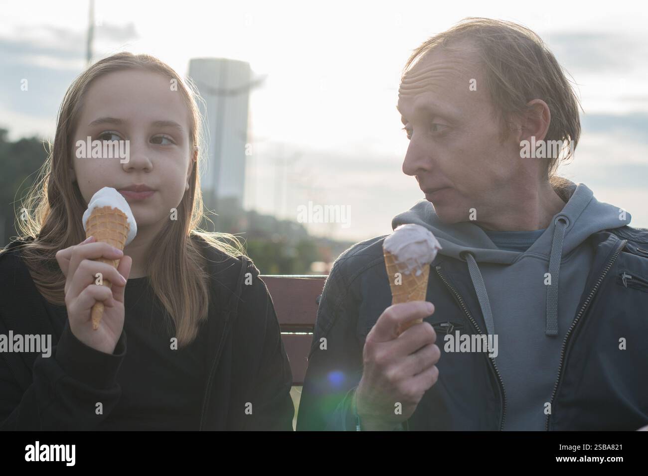 Father and daughter eating ice cream Stock Photo - Alamy