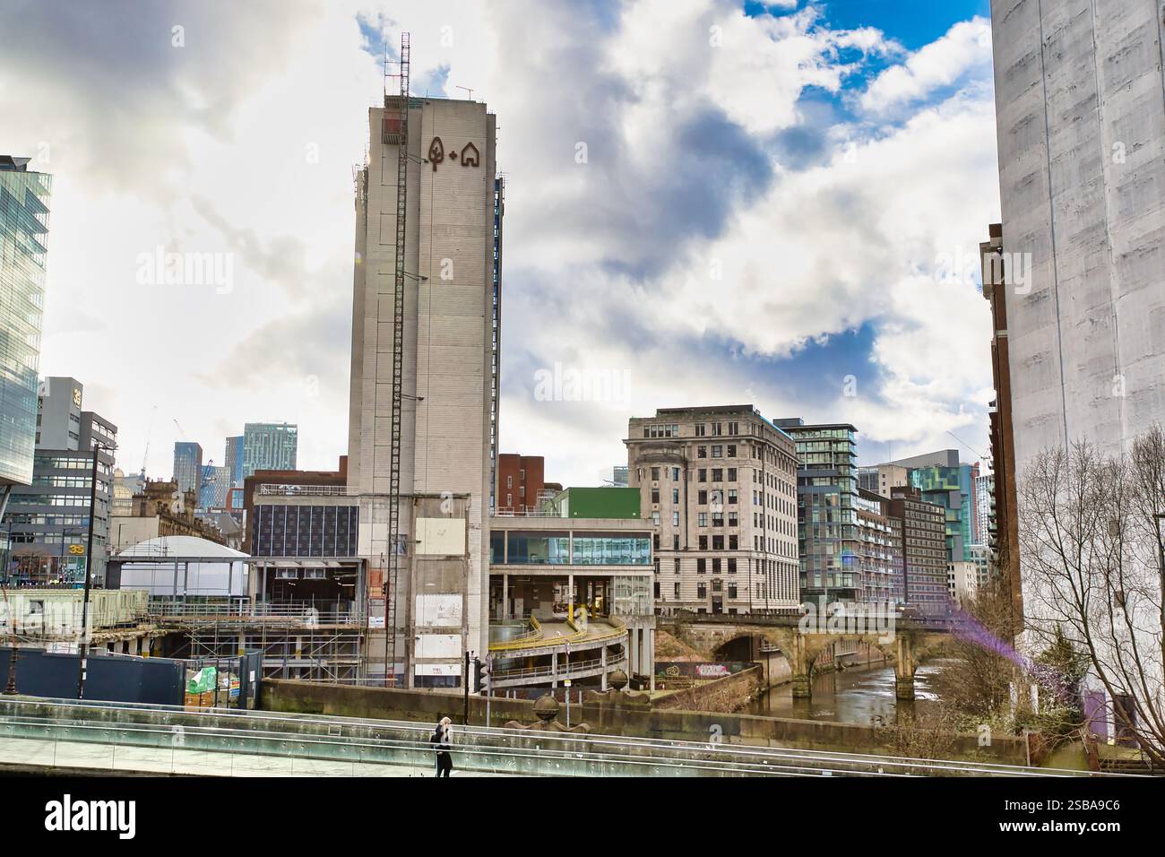 Urban cityscape featuring a tall, light-grey building under ...