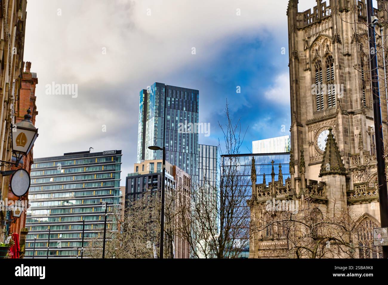 Modern skyscrapers and a historic church in a city center. The scene is ...