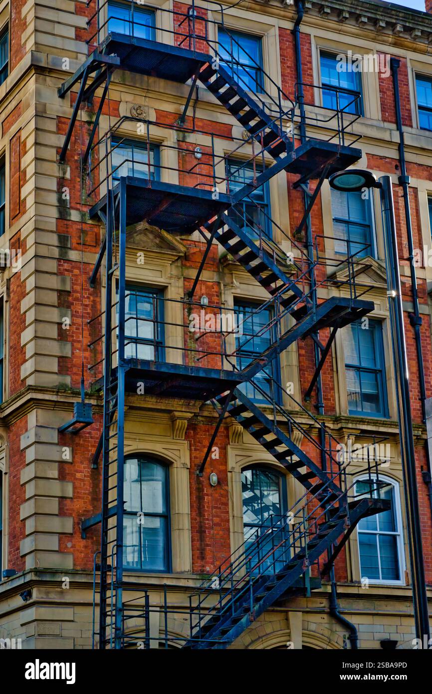 Exterior view of a brick building with multiple interconnected metal ...