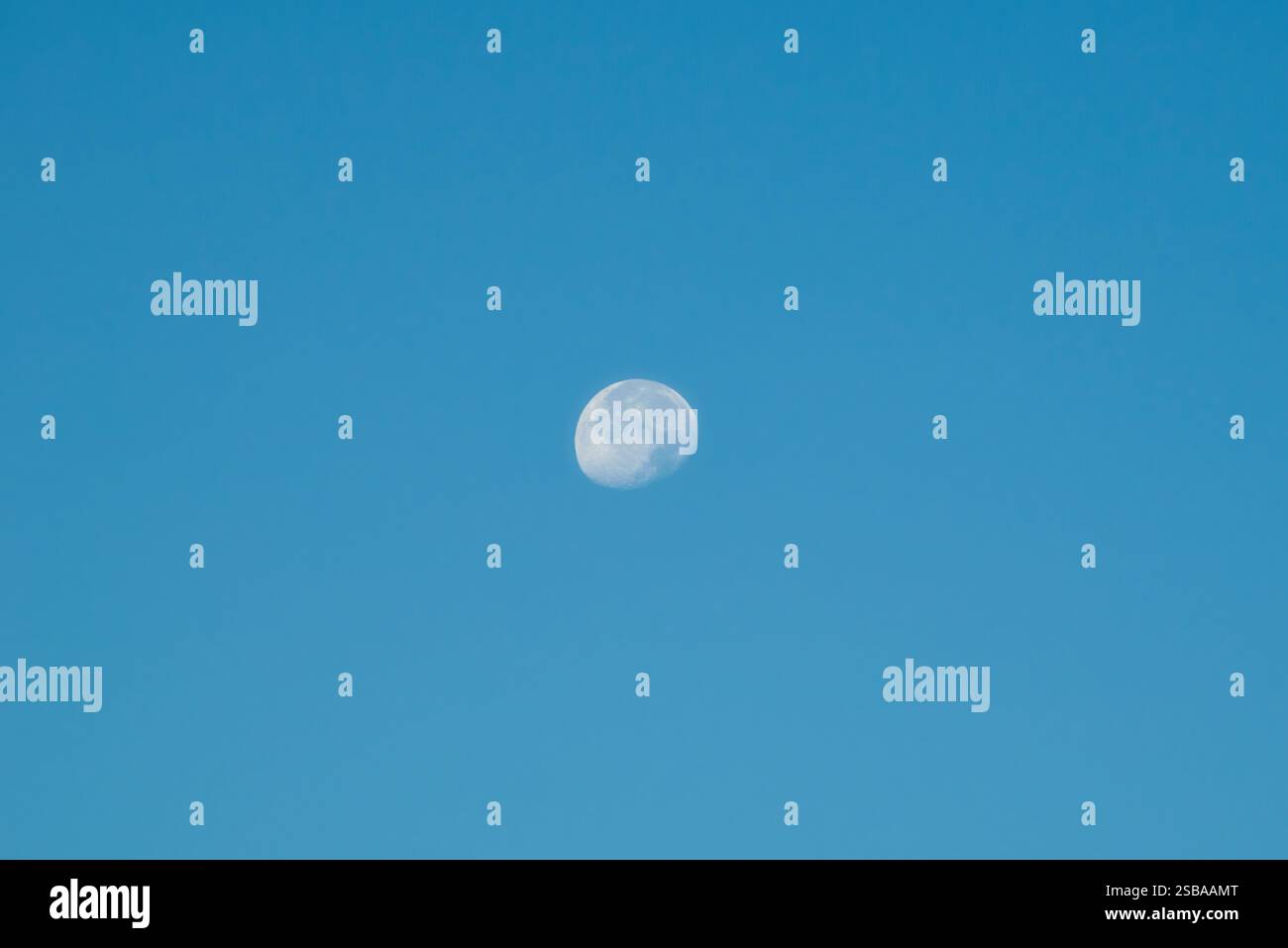Full moon through clouds and fog in a gray sky Stock Photo - Alamy