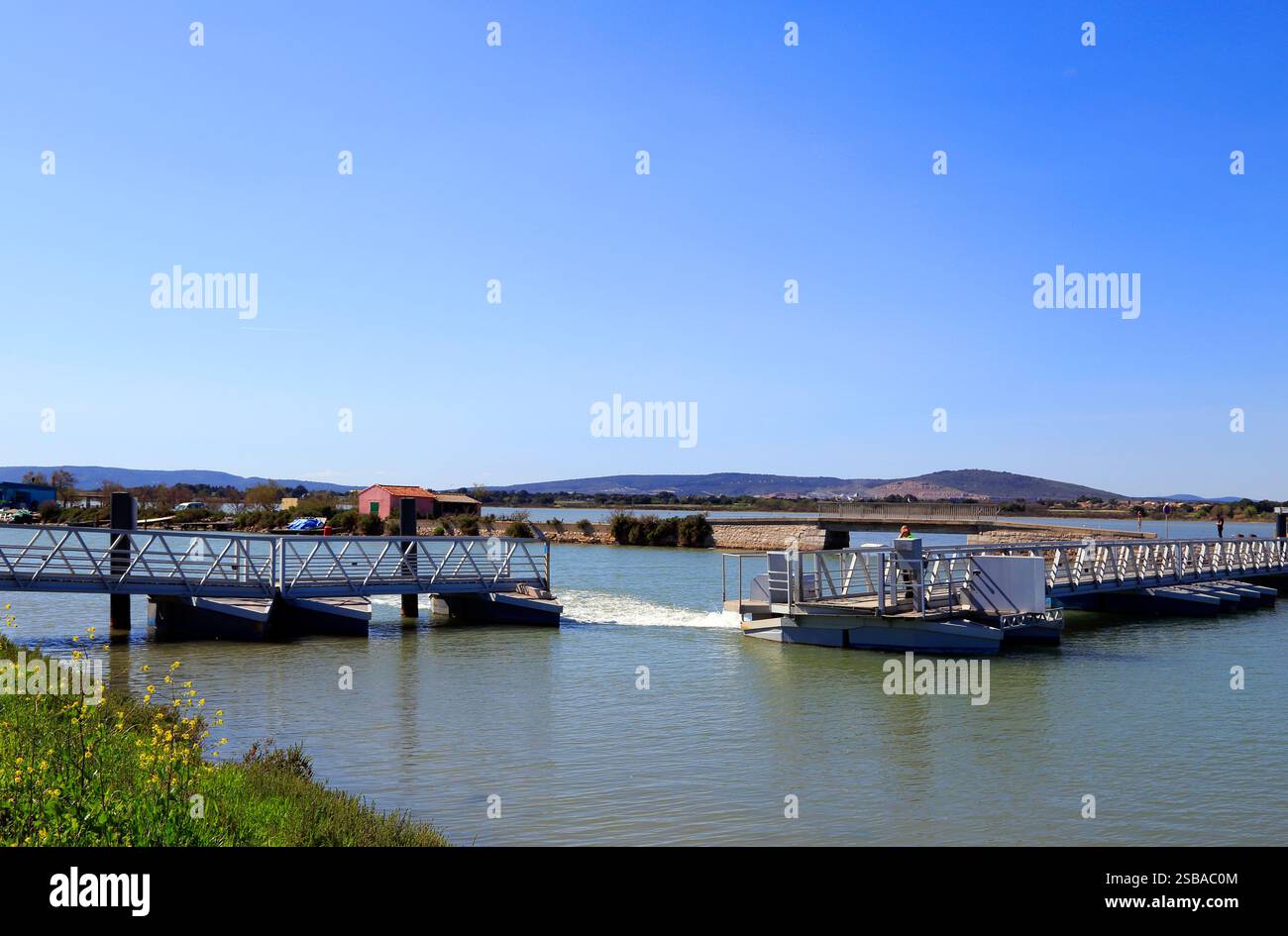 The Pilou footbridge over the Rhone Canal in Sete. The fishing huts of ...