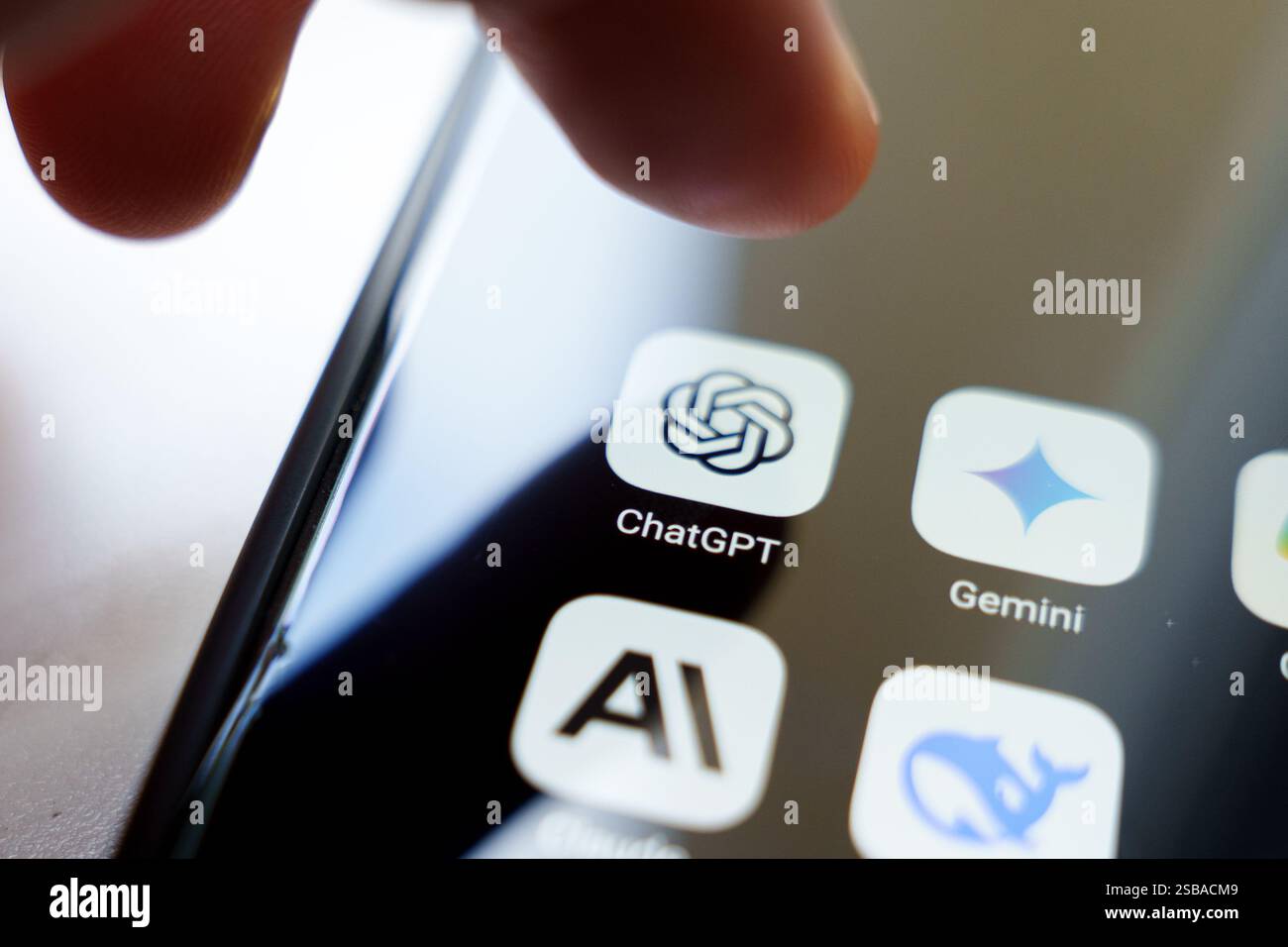 Close-up of a finger touching the ChatGPT app icon on a smartphone ...