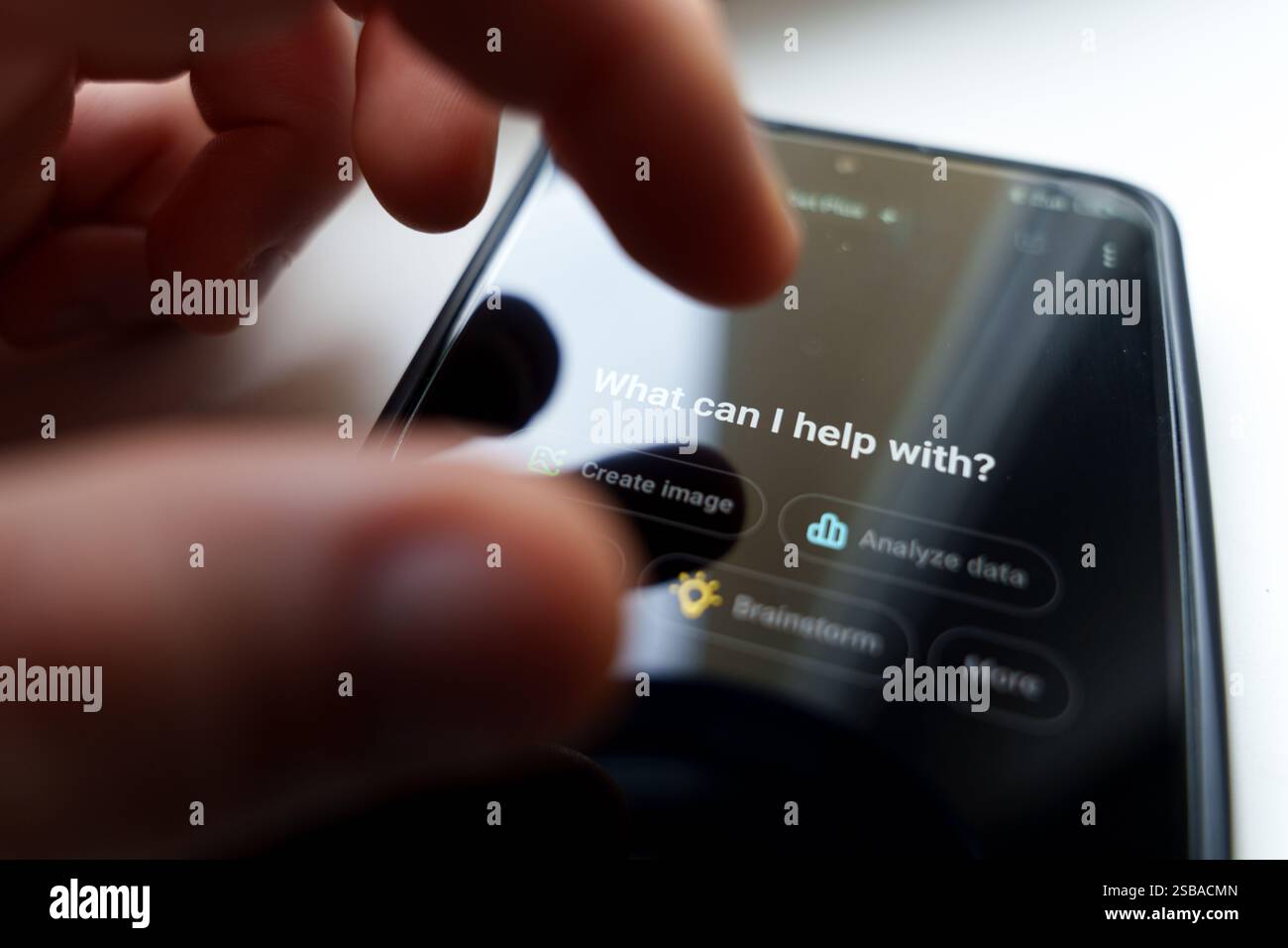 Close-up of a finger touching the ChatGPT app icon on a smartphone ...