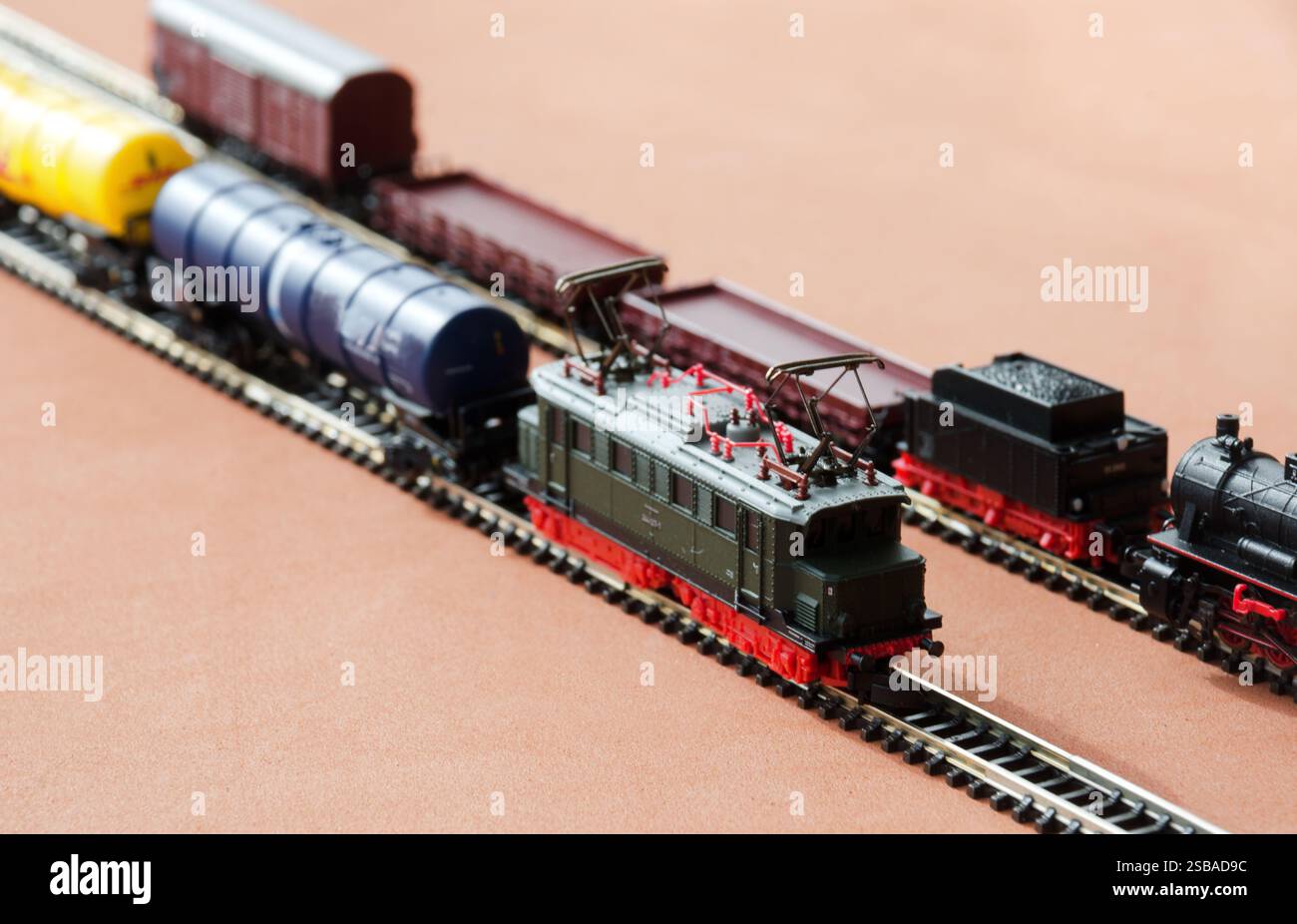 Toy passenger train and railroad with selective focus effect. Model of ...