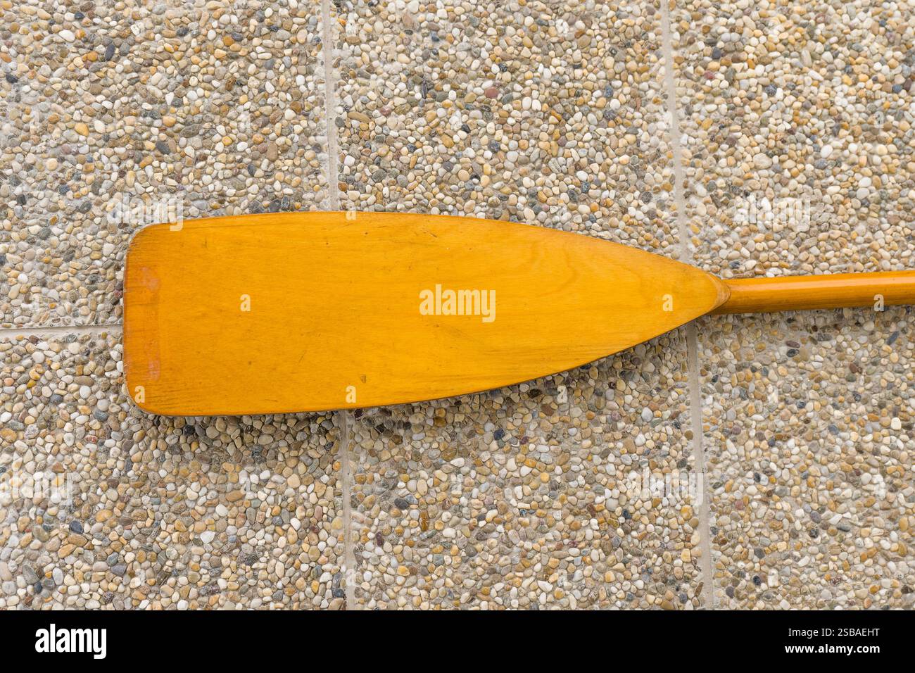 Old wooden paddle on the ground from sixties Stock Photo - Alamy