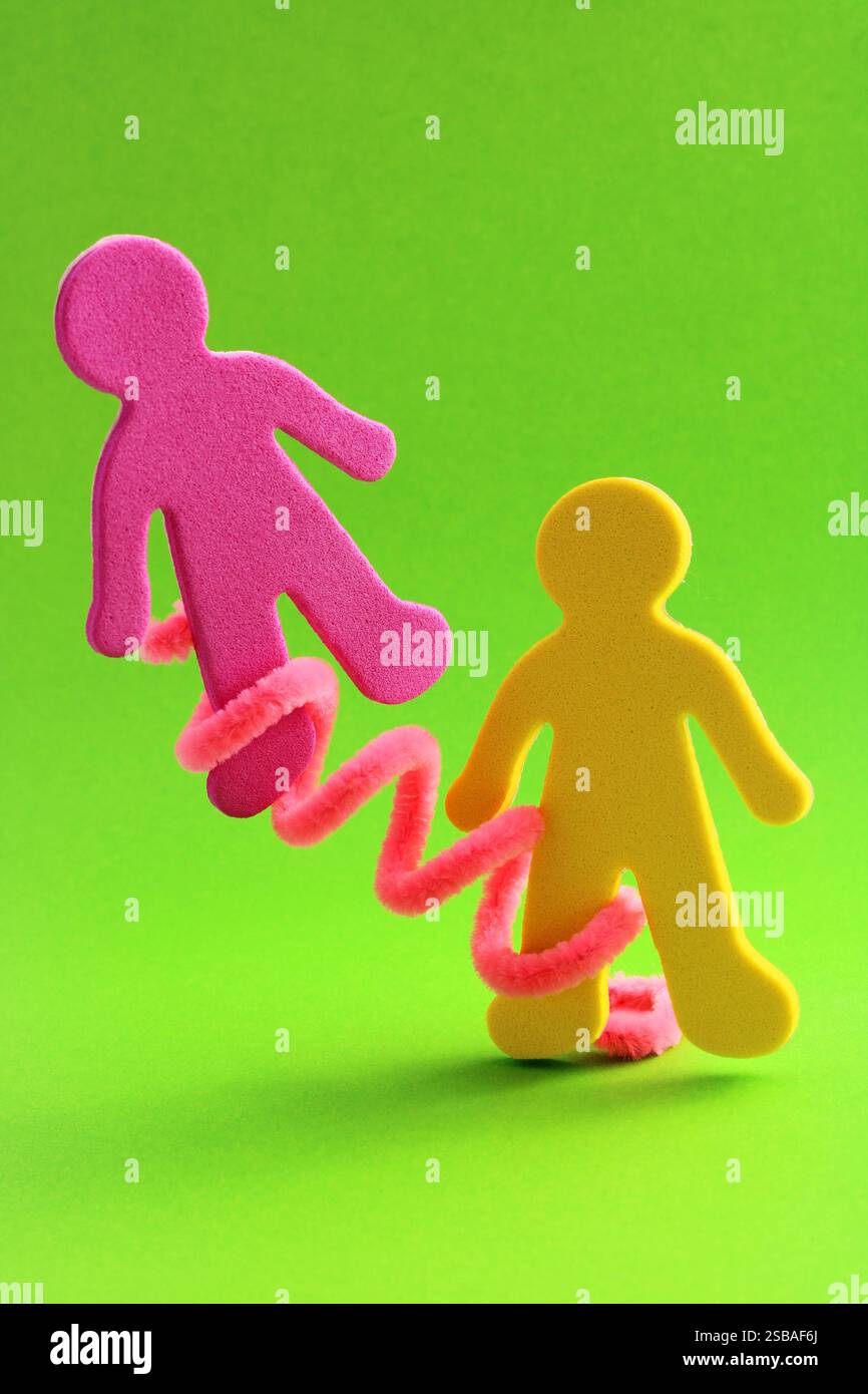 Two people trapped at the ends of a spiral - vertical format Stock ...