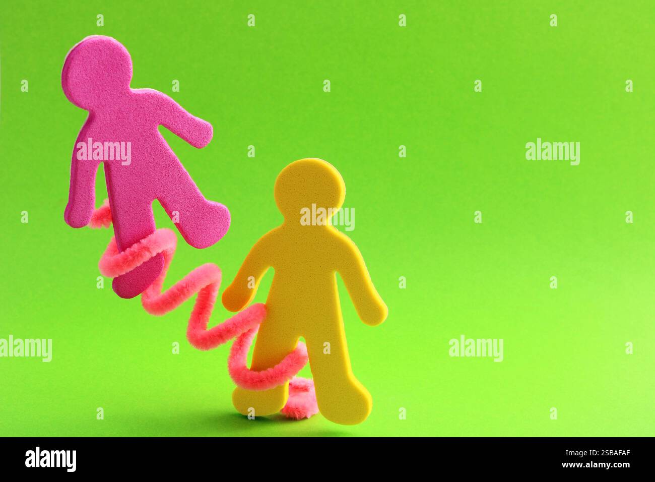 Two people trapped at the ends of a spiral Stock Photo - Alamy