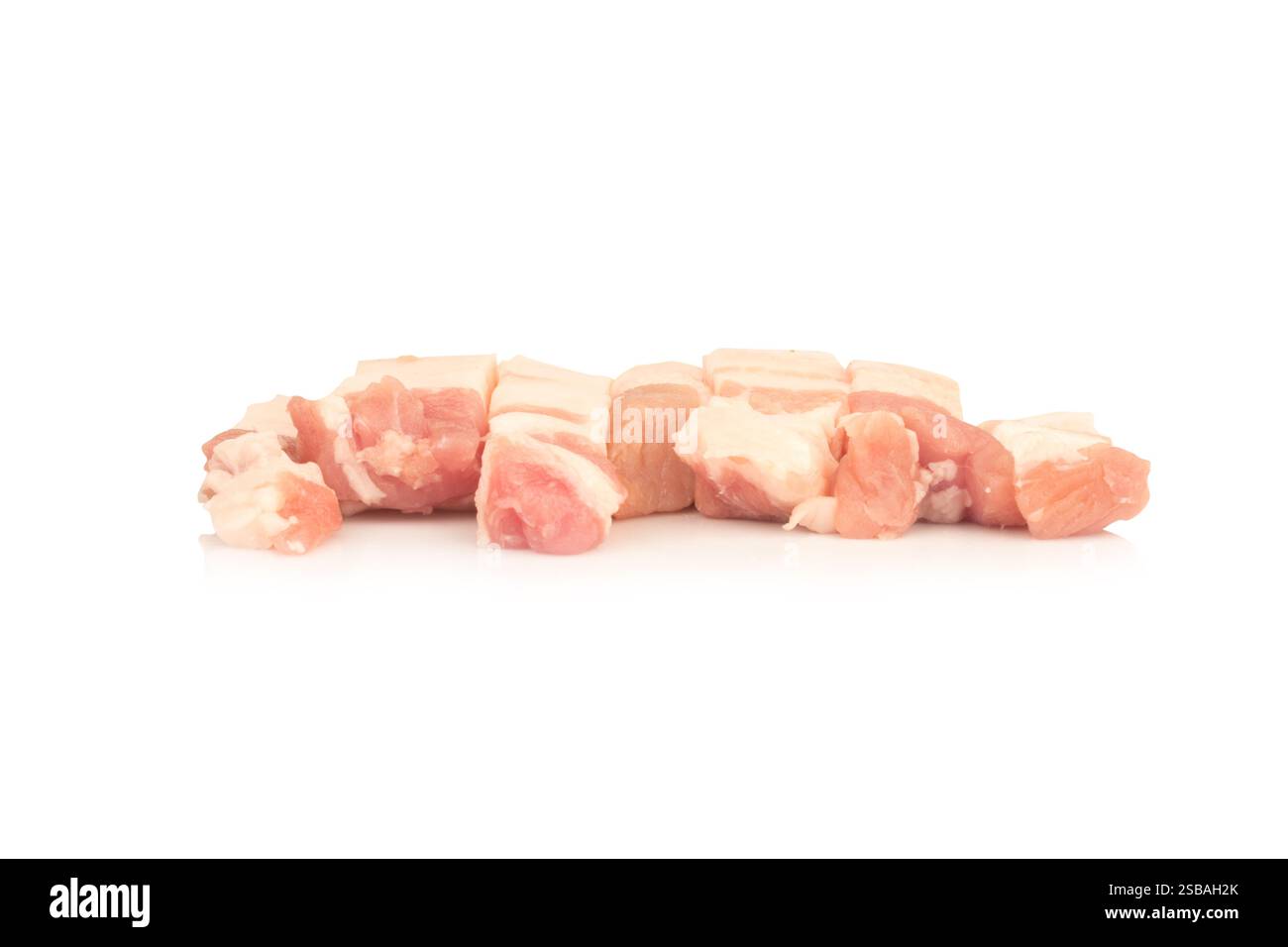 streaky pork piece cube isolated on white background Stock Photo - Alamy