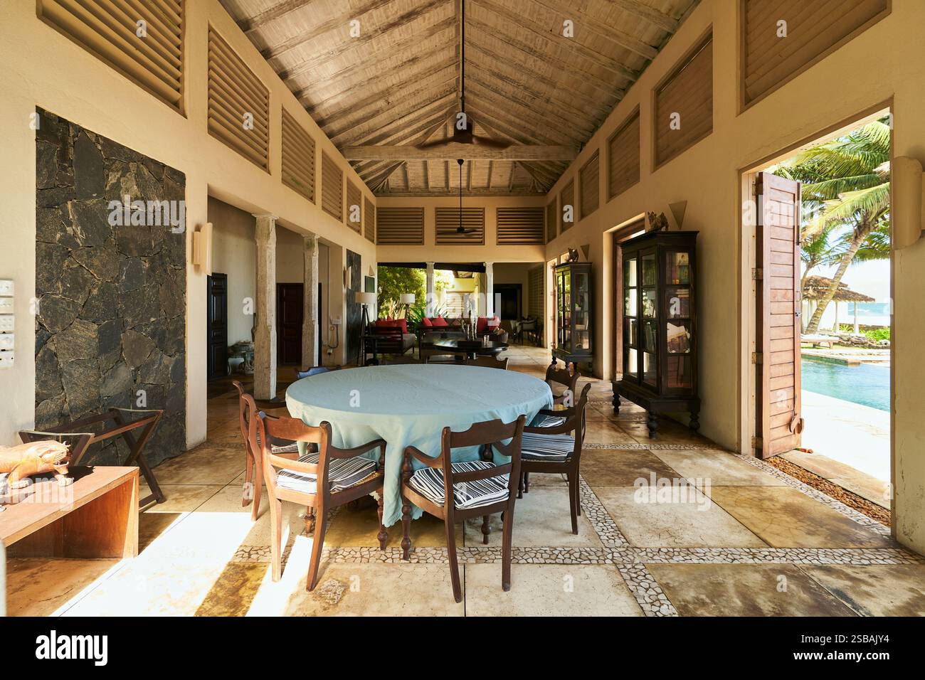 Vintage tropical villa interior with rustic furniture. Open space ...